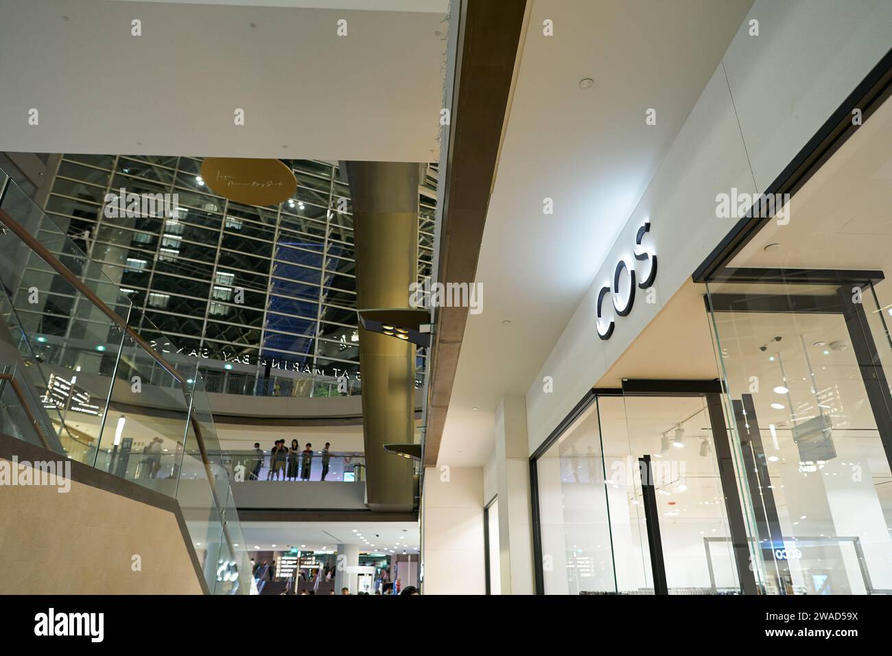 SINGAPORE - NOVEMBER 05, 2023: COS sign over store entrance in the ...