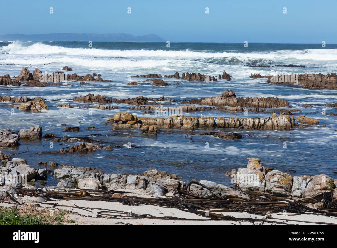 South Africa, Hermanus, Rocky coastline and sea at Onrus Beach Stock ...