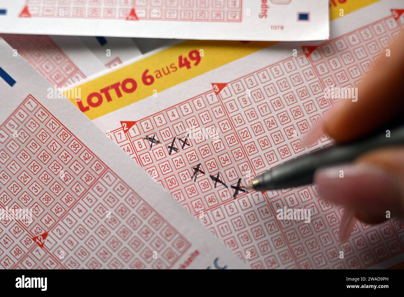 Duesseldorf, Germany. 03rd Jan, 2024. A player fills out a lottery ...