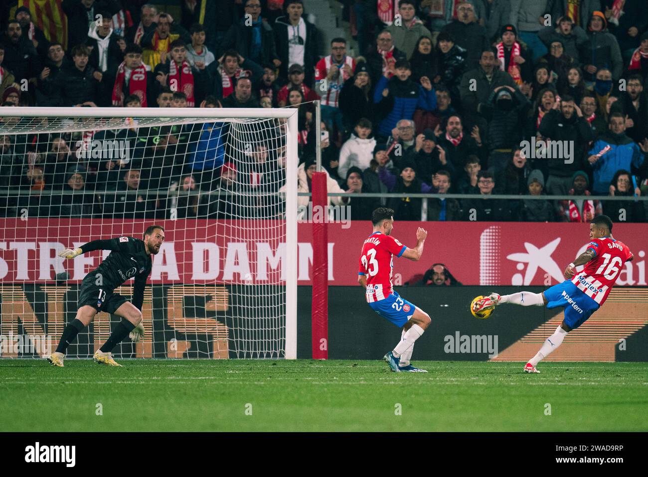 Girona, Spain. 3rd Jan, 2024. Savio Moreira de Oliveira (R) of Girona FC shoots to score during ...