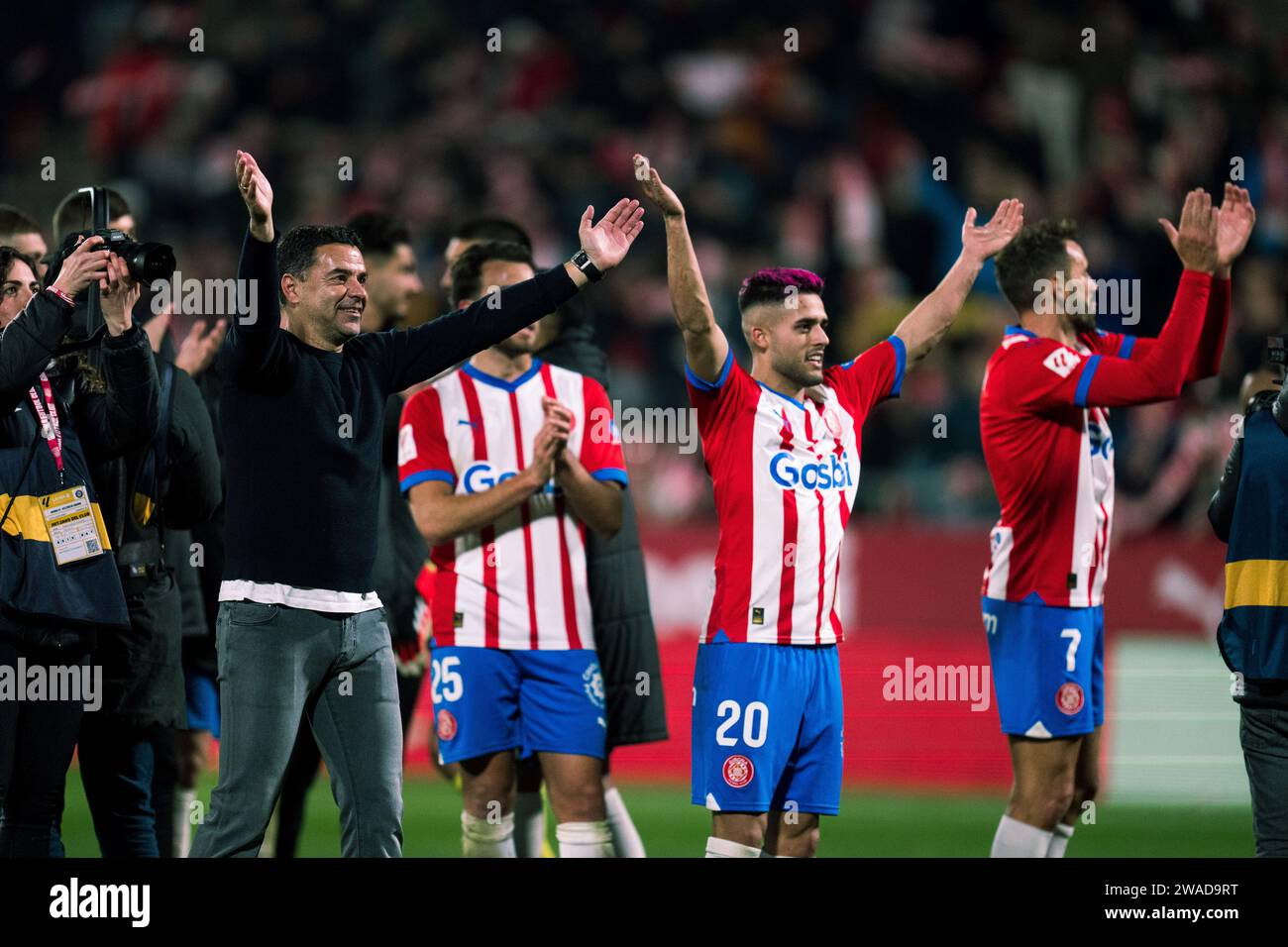 Girona, Spain. 3rd Jan, 2024. Girona FC's head coach Michel Sanchez (front L) and players ...