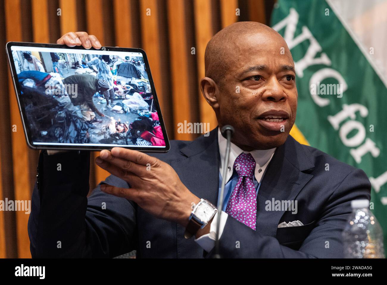 Mayor Eric Adams holds photo of homeless camp in San Francisco while ...