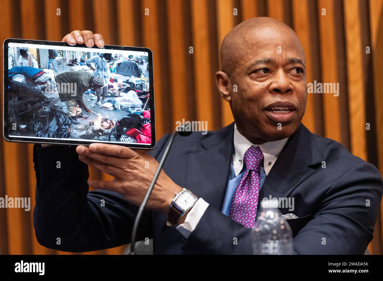 Mayor Eric Adams holds photo of homeless camp in San Francisco while ...