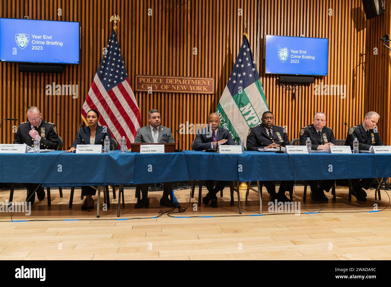 Mayor Eric Adams speaks as Police Commissioner Edward Caban listens ...