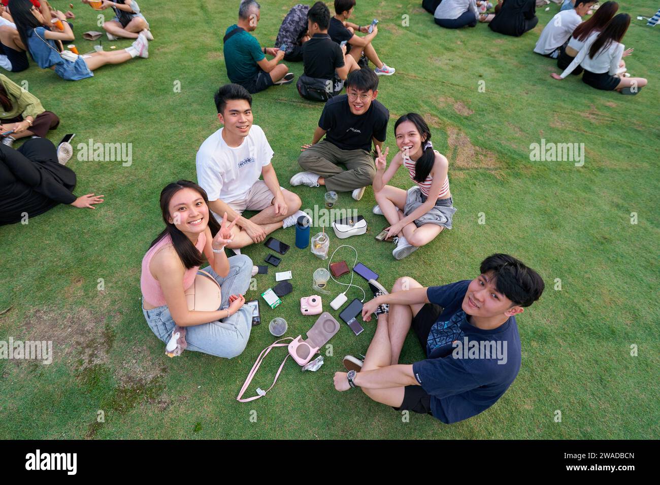 KUALA LUMPUR, MALAYSIA - CIRCA MAY, 2023: people sit and posing in the ...