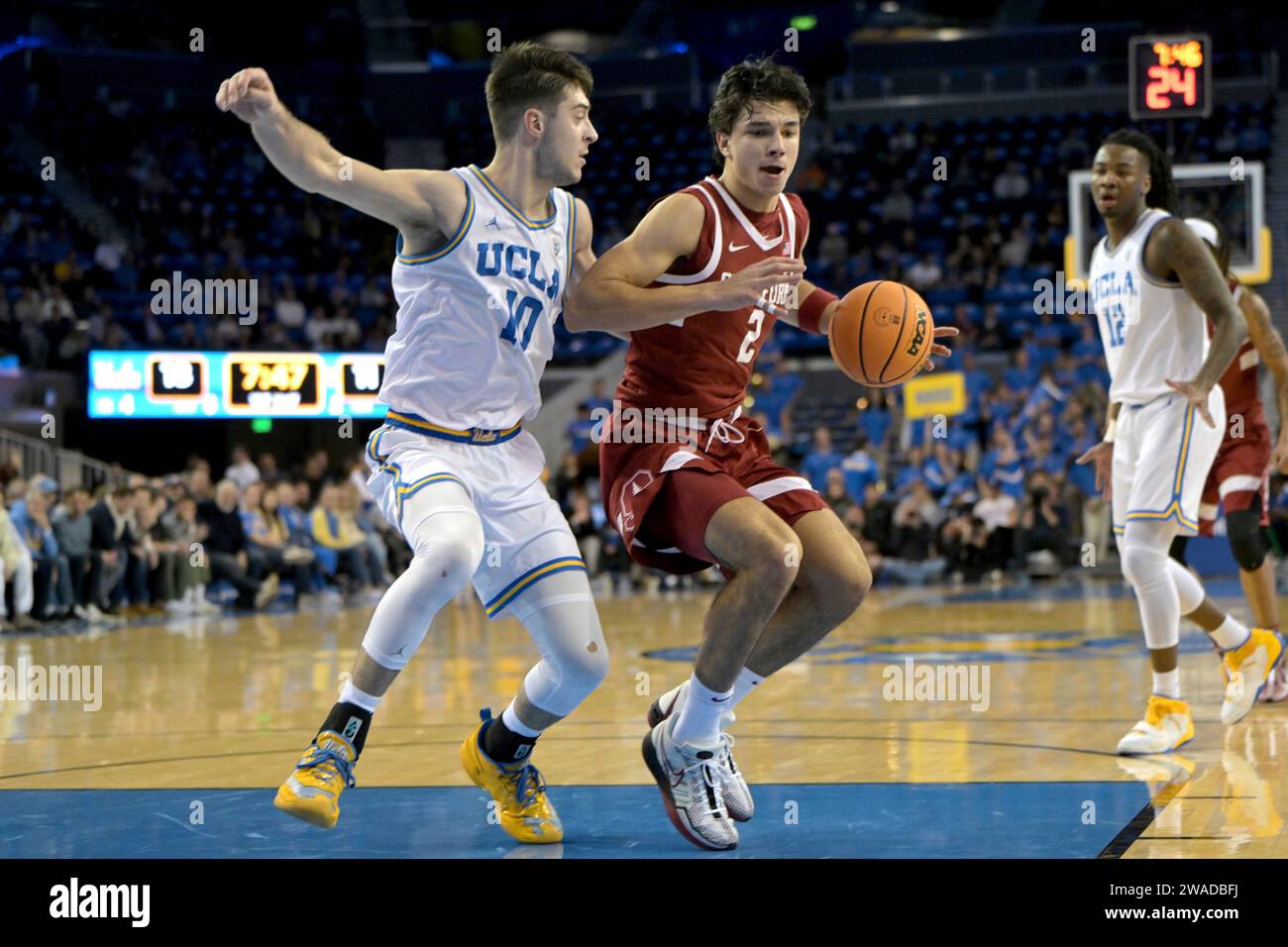 UCLA guard Lazar Stefanovic left, defends against Stanford guard Andrej ...