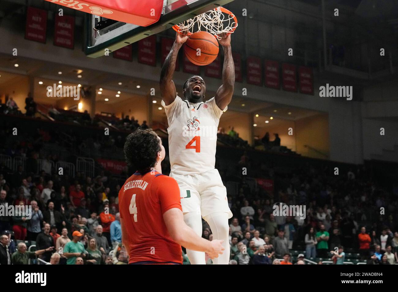 Miami guard Bensley Joseph (4) dunks the ball over Clemson forward Ian ...