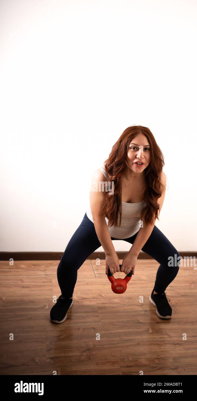 Fit woman exercising kettlebell in hi-res stock photography and images ...