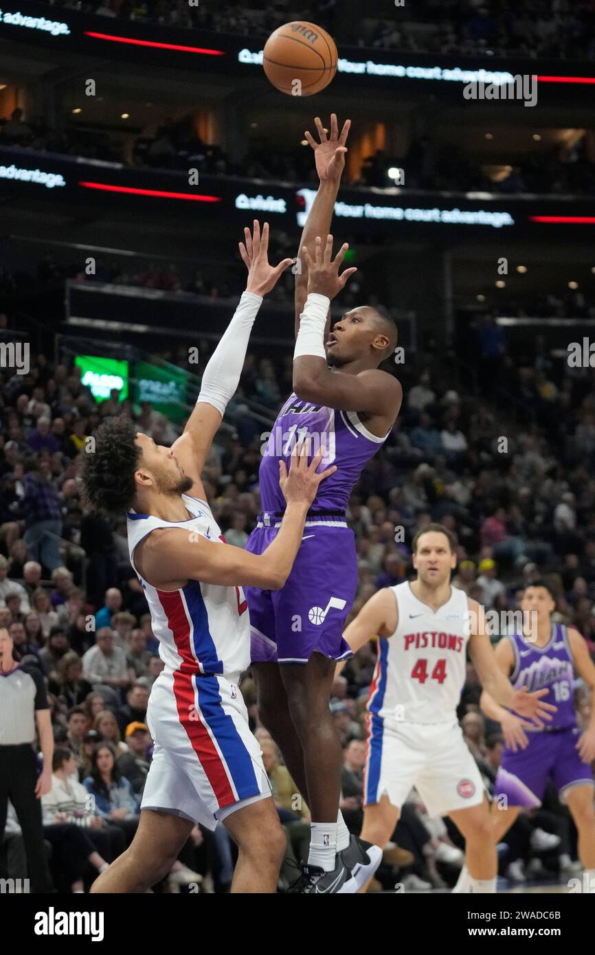 Utah Jazz guard Kris Dunn (11) shoots as Detroit Pistons guard Cade ...