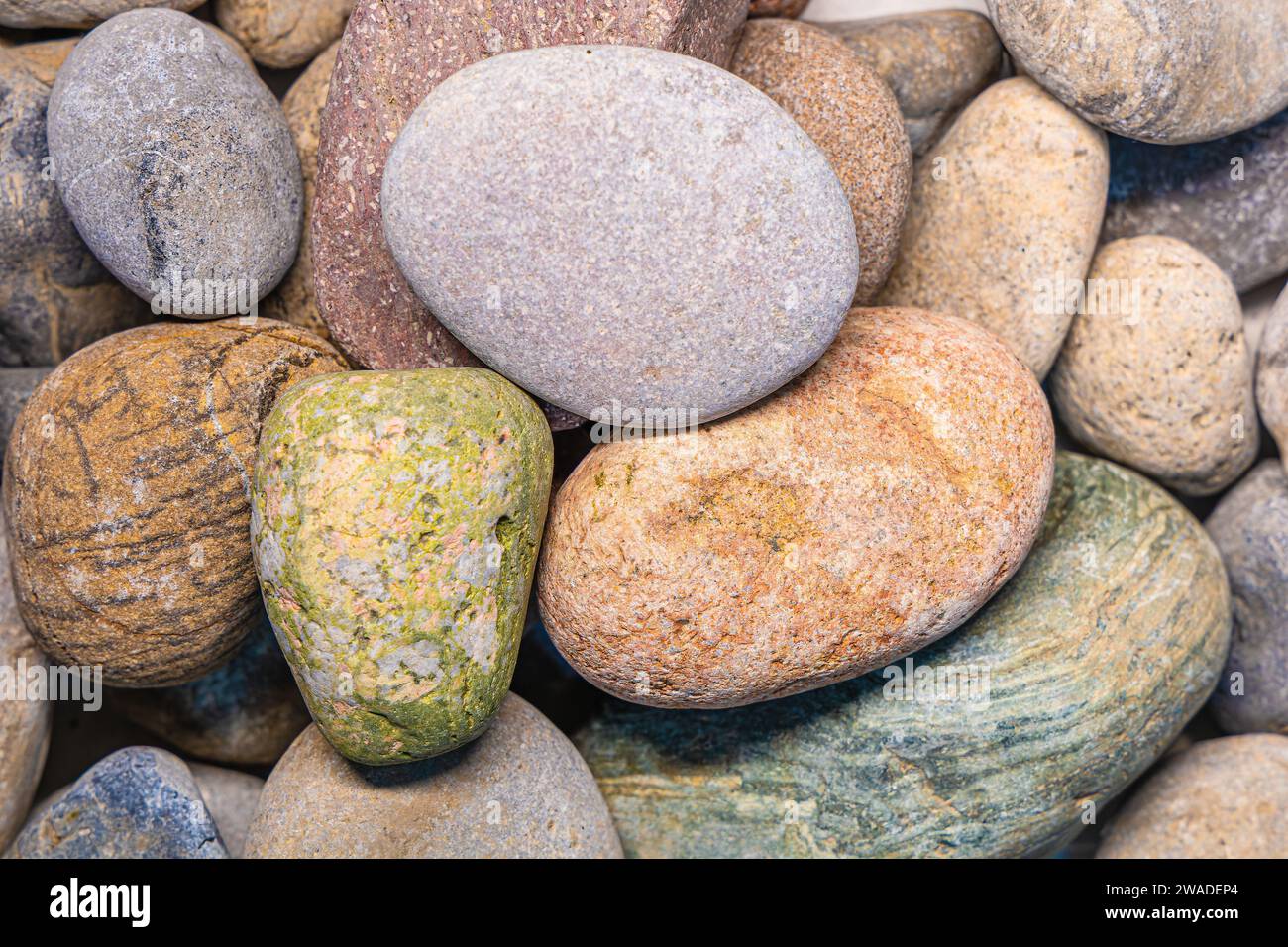 Natural natural stones of different colors with a slightly textured ...
