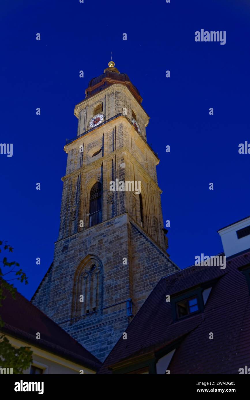 The evening sky is illuminated by the striking church tower of St ...