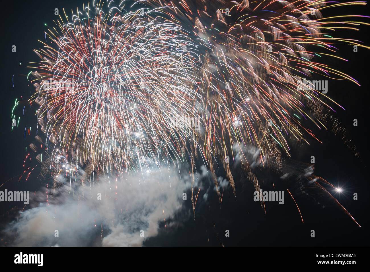 Colourful fireworks light up the night sky with sparkling lights and ...
