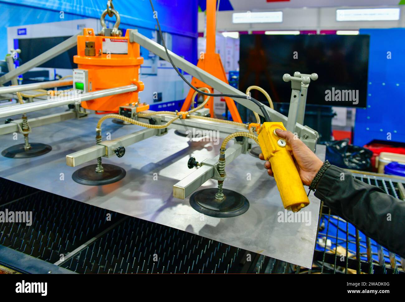 A worker is pressing a steel plan control button to enter the steel ...