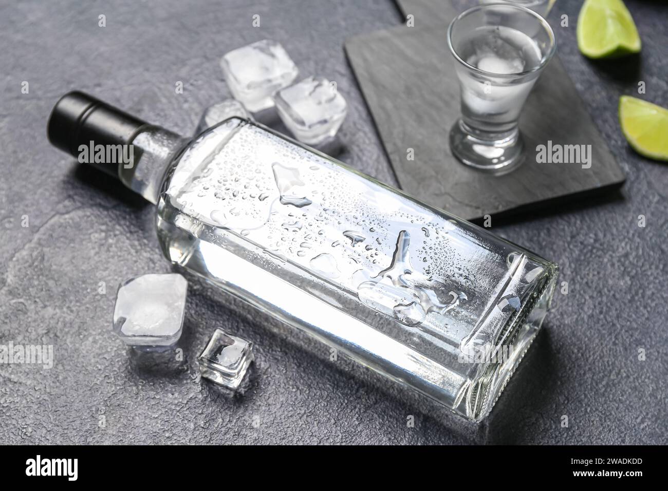 Bottle of cold vodka on black background Stock Photo - Alamy