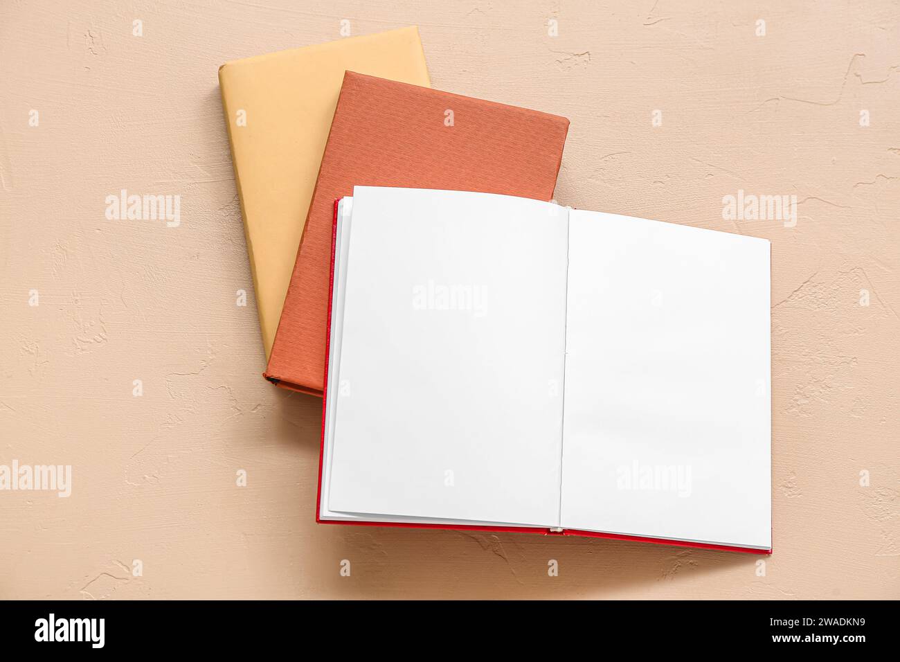 Open book with blank pages on beige background Stock Photo - Alamy