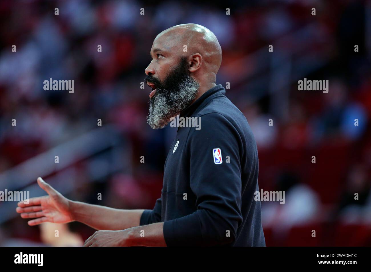 Brooklyn Nets head coach Jacque Vaughn talks with players on the court ...