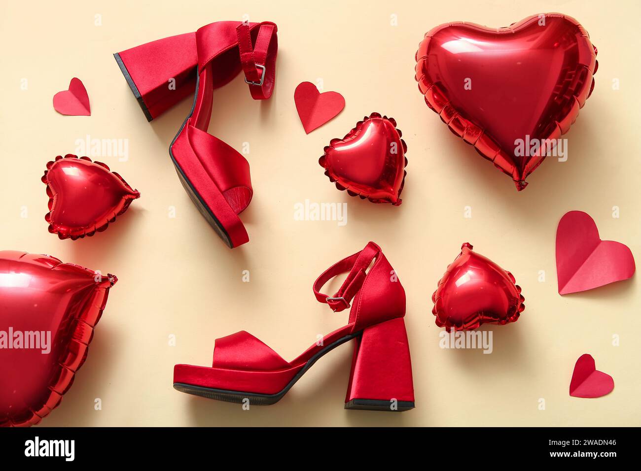 Composition with stylish female shoes, heart-shaped balloons and paper ...