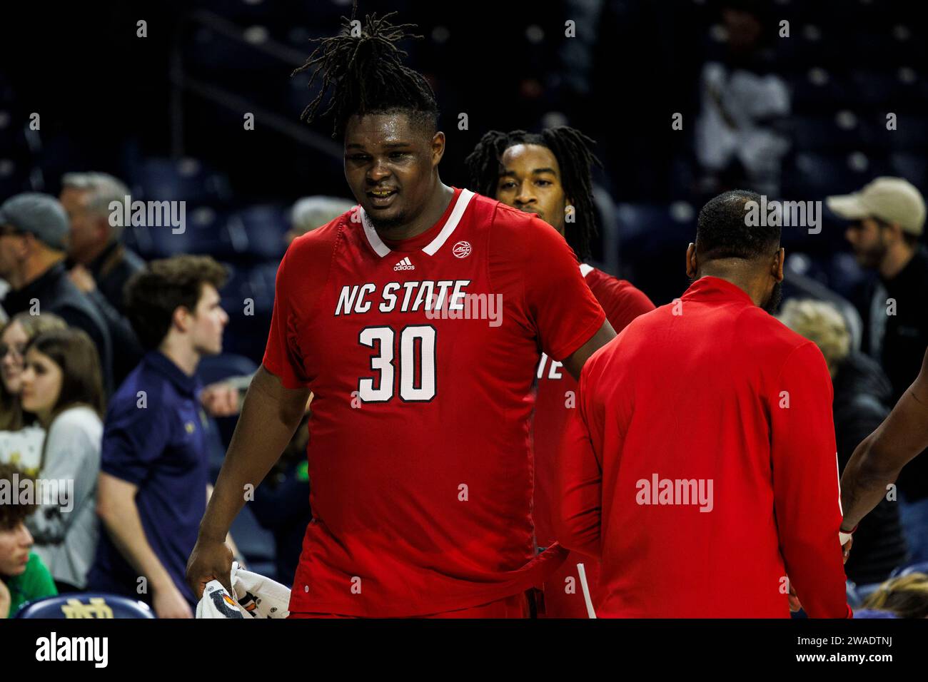 January 03, 2024: North Carolina State forward DJ Burns Jr. (30) smiles ...