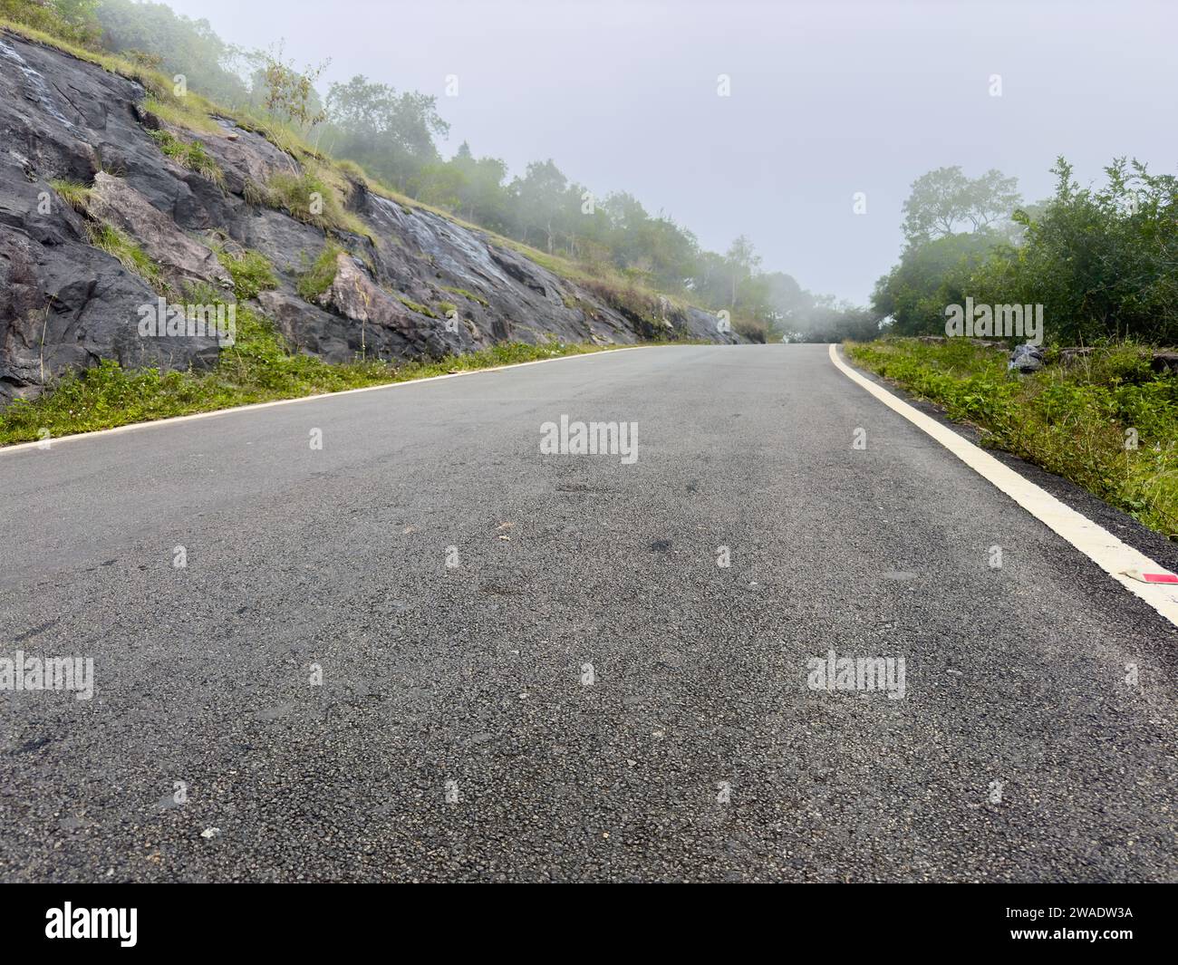 Foggy ghat road along Pandrimalai village close to the popular tourist ...