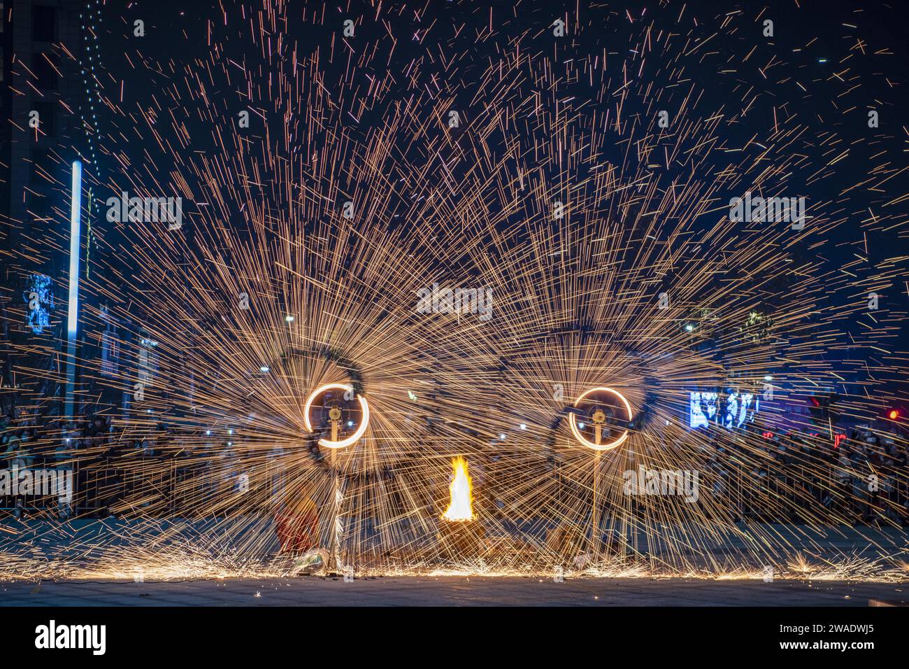 A traditional iron spraying known as Datiehua is staged in Yuyao City ...