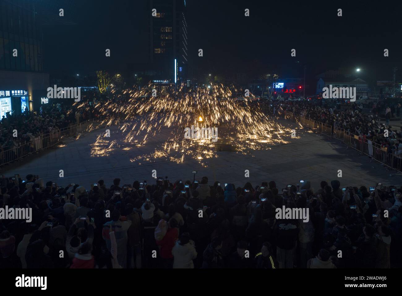A traditional iron spraying known as Datiehua is staged in Yuyao City ...