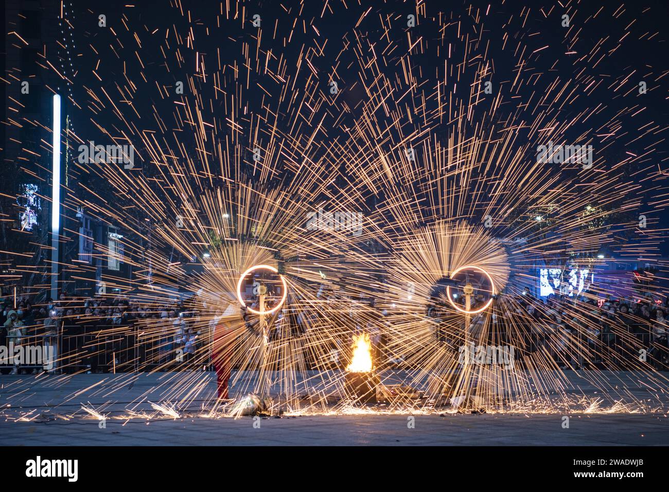 A traditional iron spraying known as Datiehua is staged in Yuyao City ...