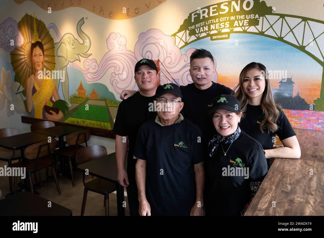 Owner David Rasavong, center, joined by his family, his wife Anna Le ...