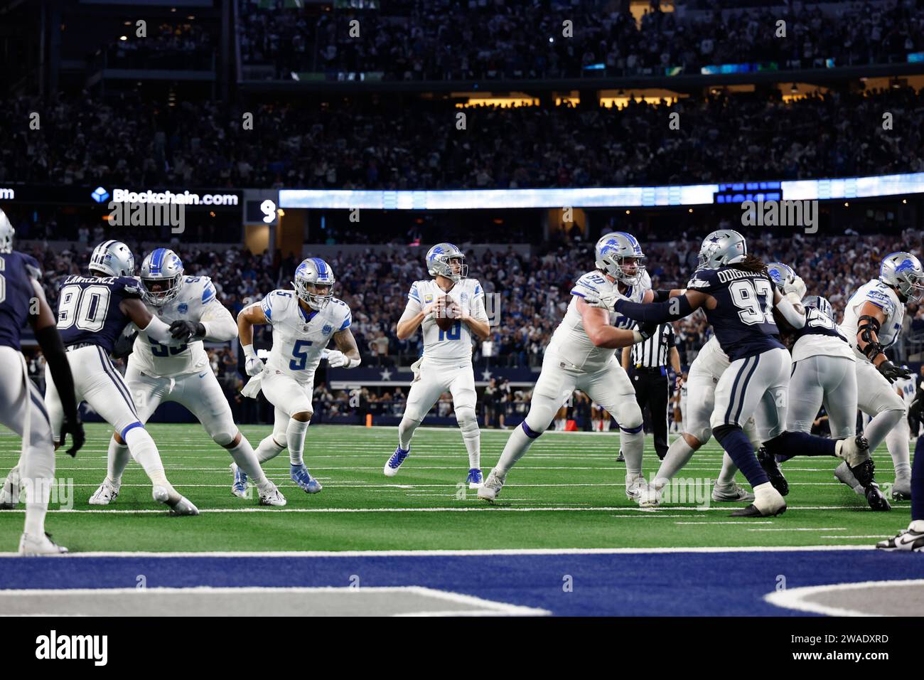 Detroit Lions quarterback Jared Goff (16) looks to pass behind blocking ...