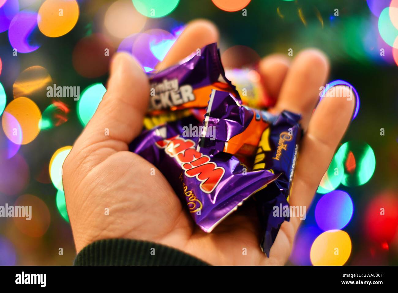 a hand full of sweets Stock Photo - Alamy