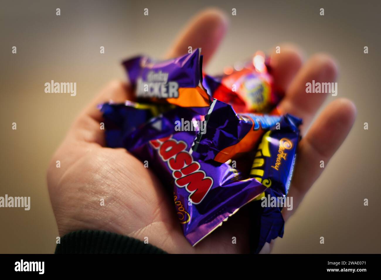 Hand full of sweets hi-res stock photography and images - Alamy