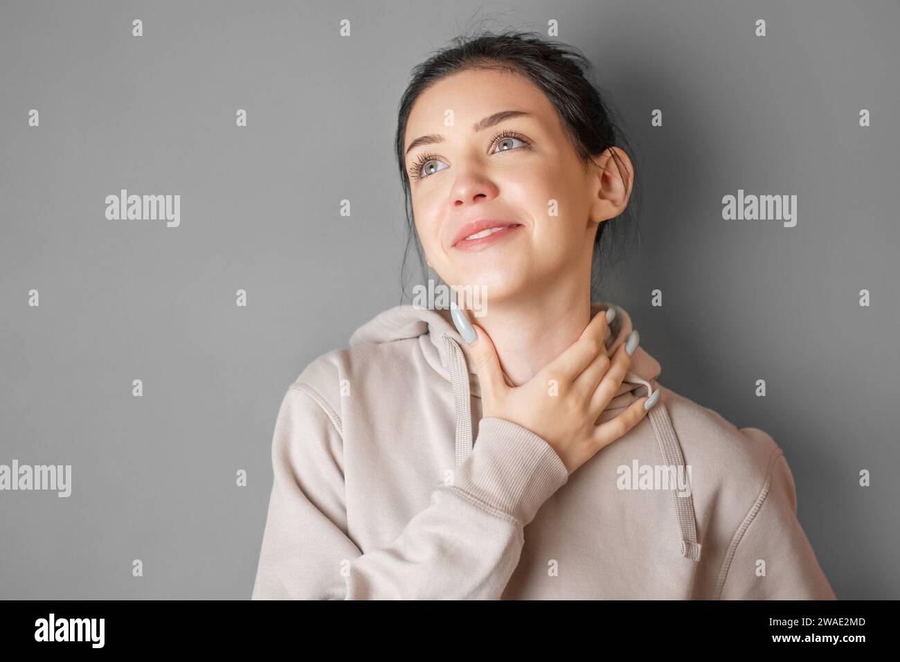 Portrait of a young pretty smoling girl in a hoodie Stock Photo - Alamy