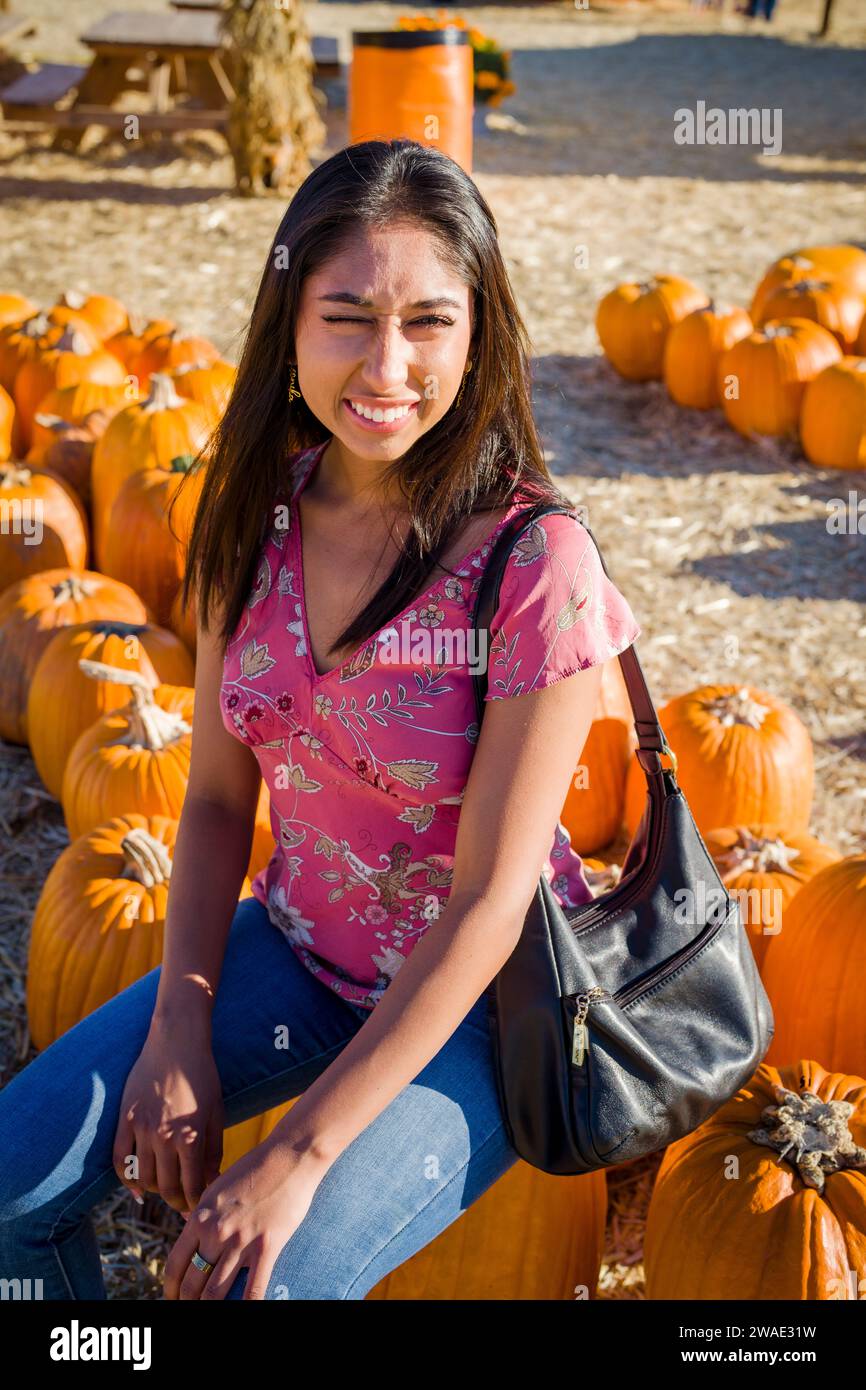 Teen Asian Girl Female Sitting on Large Pumpkin Patch Farm Denim Purse ...