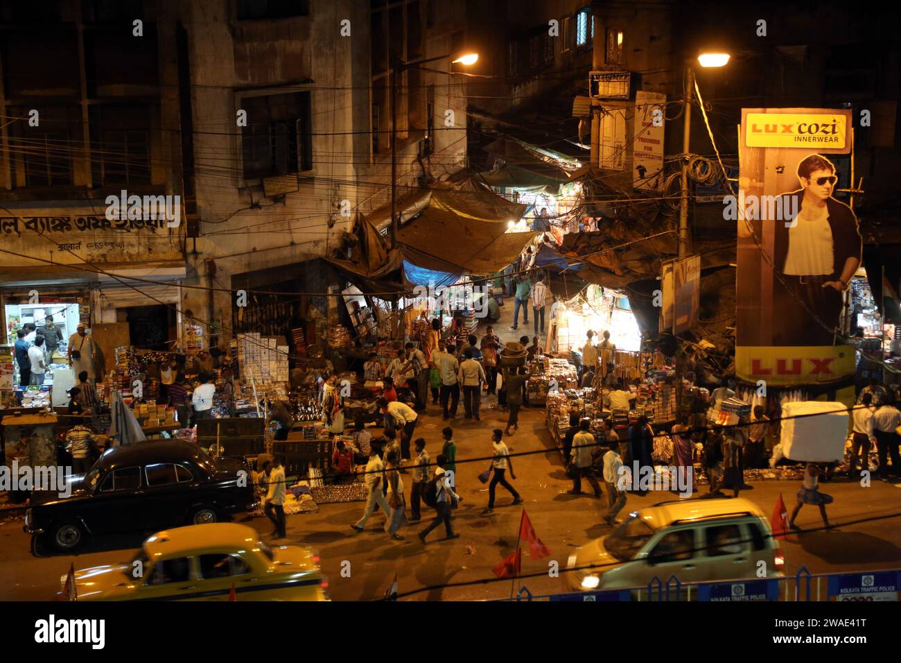 Dark city traffic blurred in motion at late evening on crowded streets ...