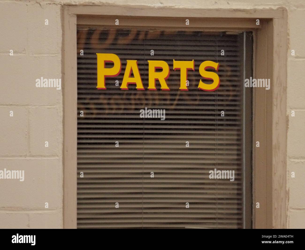The exterior window of a non-distinct auto repair shop with Parts ...