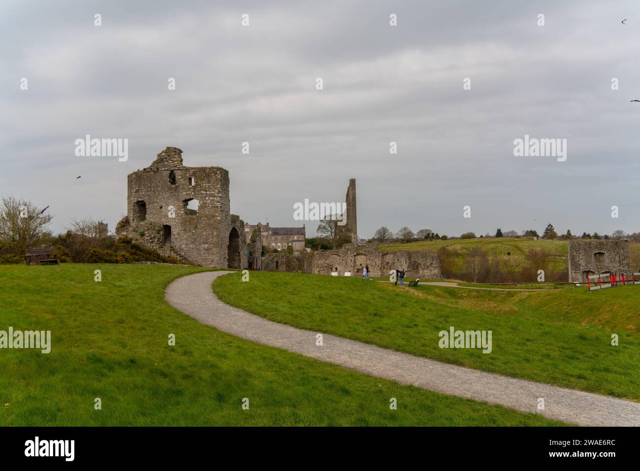 The Trim Castle in County Meath Ireland with a narrow walk path and ...