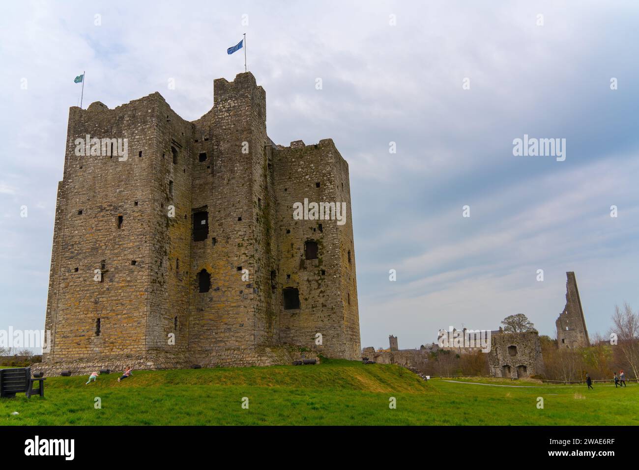 The Trim Castle in County Meath Ireland with a green area and tourist ...