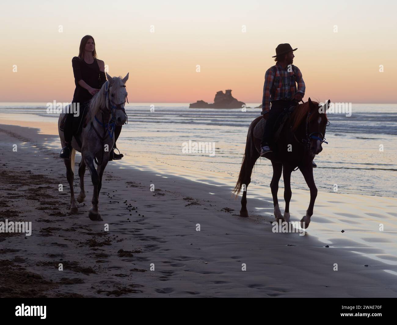Riding horses at sunset hi-res stock photography and images - Alamy