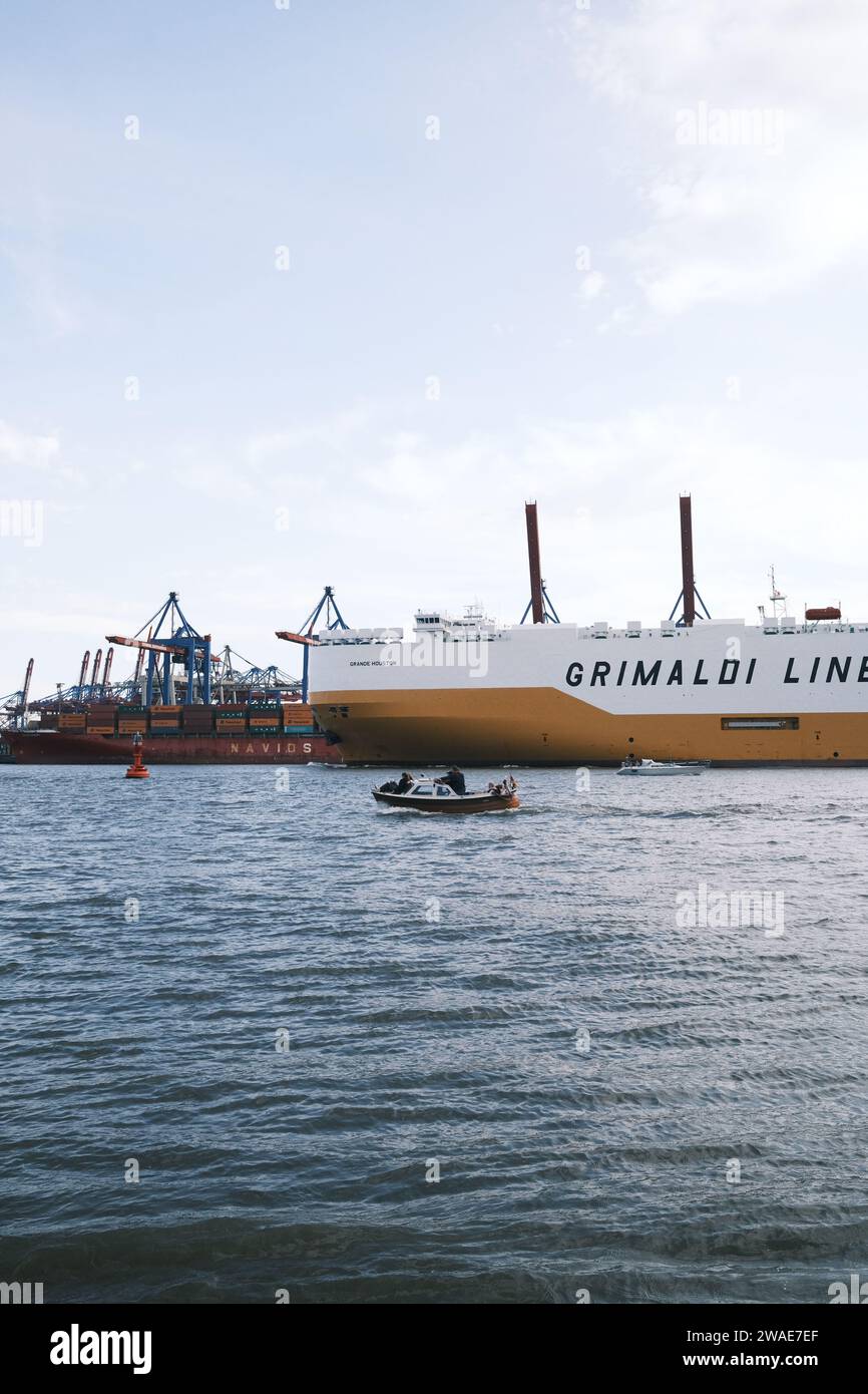 A vertical shot of the Grimaldi line cargo ship on the waters of the ...