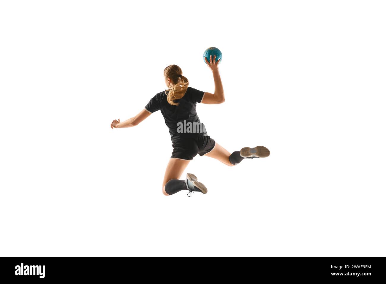Active female handball player demonstrating throwing techniques ...