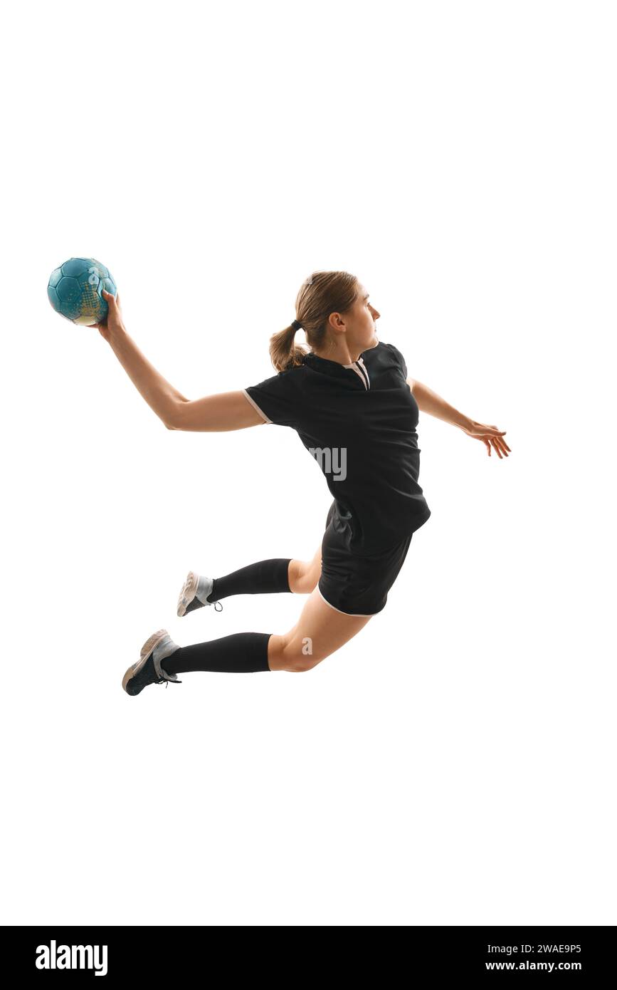 Fit, young, competitive female handball player demonstrating throwing ...