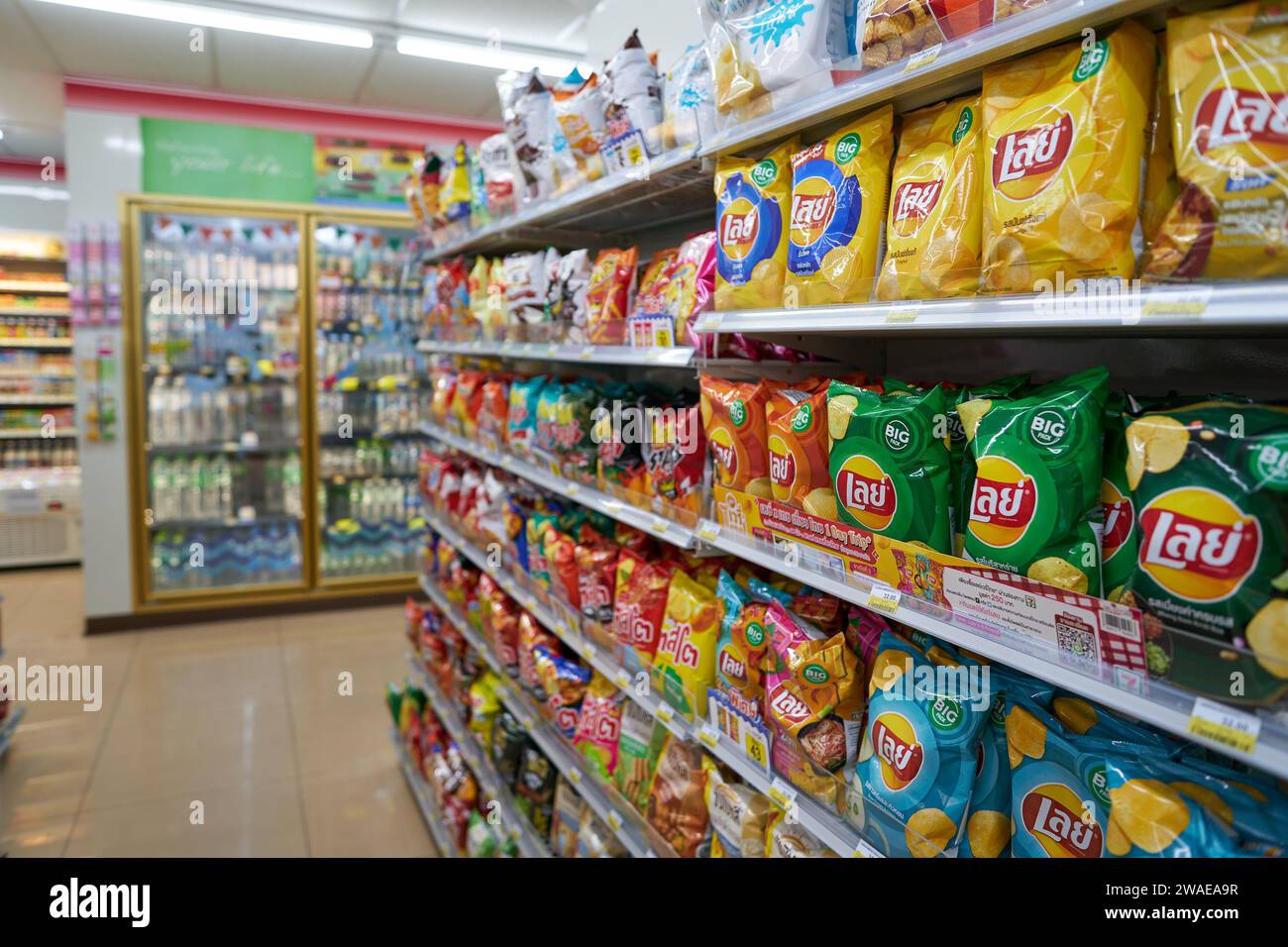PHUKET, THAILAND - APRIL 15, 2023: potato chips Lay's on display inside 7-Eleven convenience ...