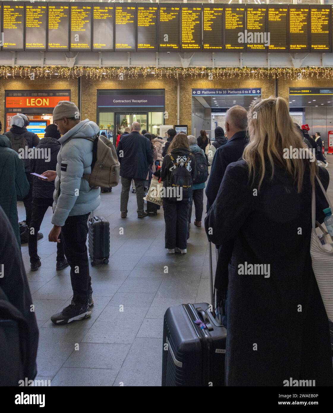 Crowd passengers wait board hi-res stock photography and images - Alamy