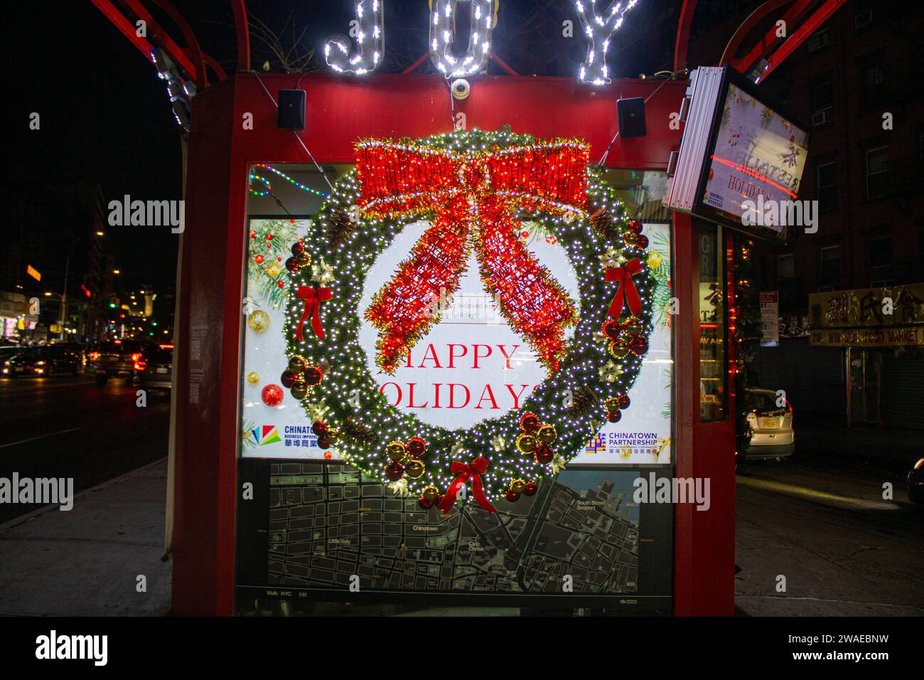 A festive phone booth with a 'Happy Holidays' sign on the front on ...