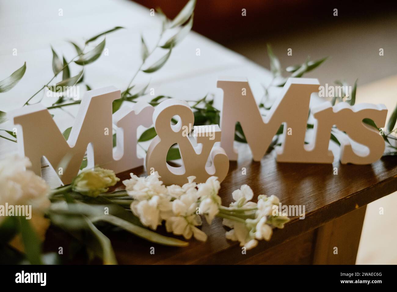 An ornately designed wooden table with the words Mrs and Mr Stock Photo ...