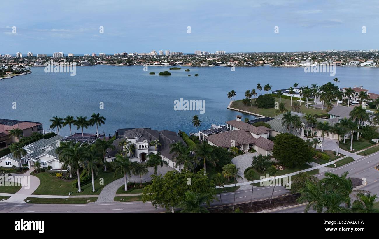 An aerial view of Marco Island, Florida with lush green vegetation and ...