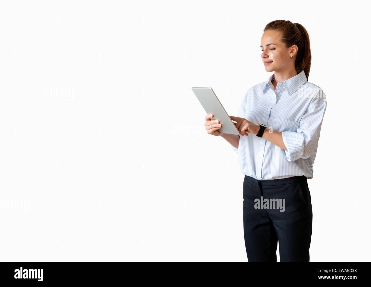 Isolated businesswoman wearing formal outfit using digital tablet Stock ...