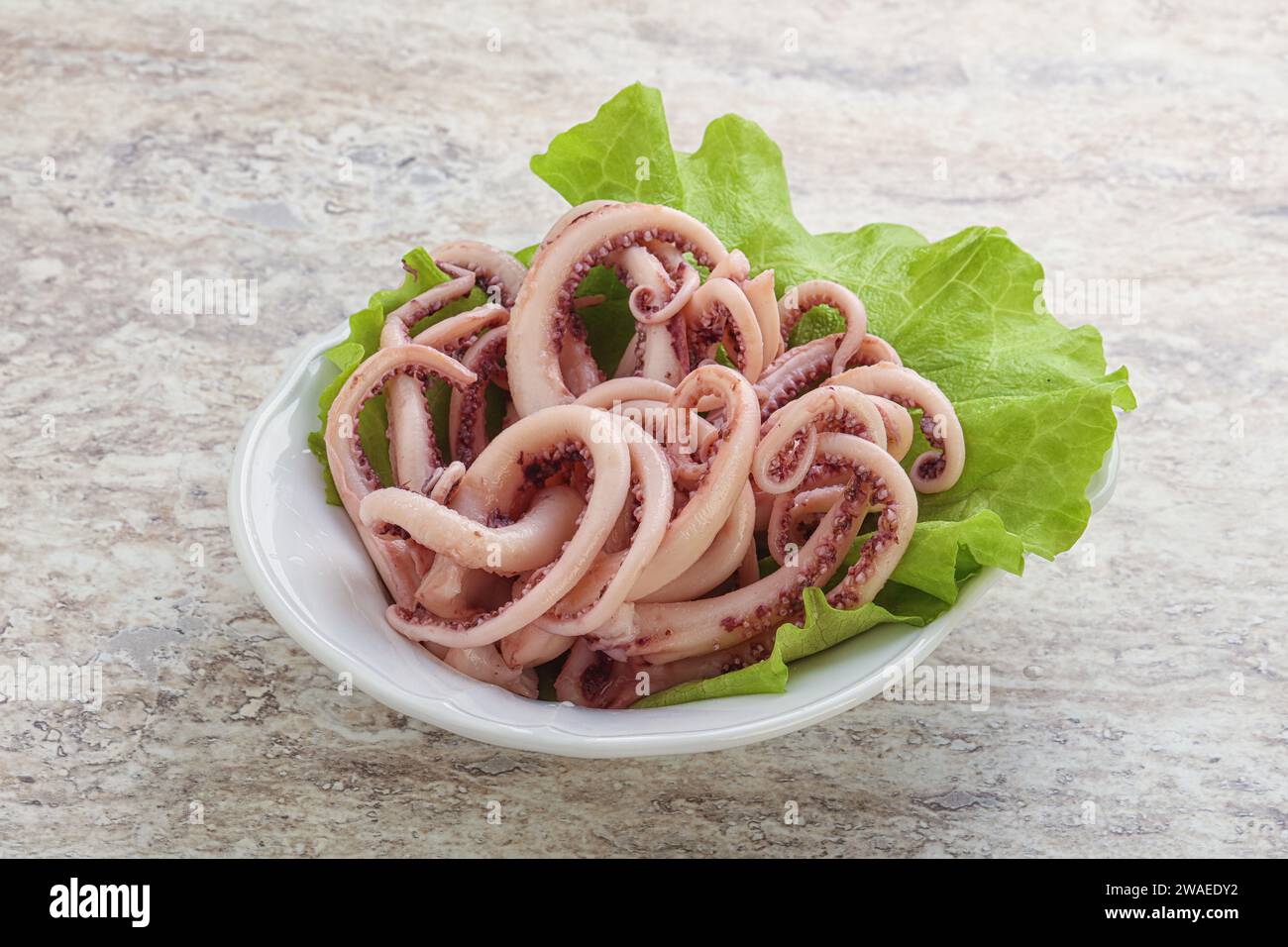 Marinated squid kalamri tentacles in the bowl Stock Photo - Alamy
