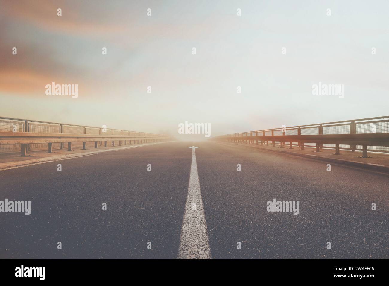 surreal arrow on a road indicates the right direction to follow ...