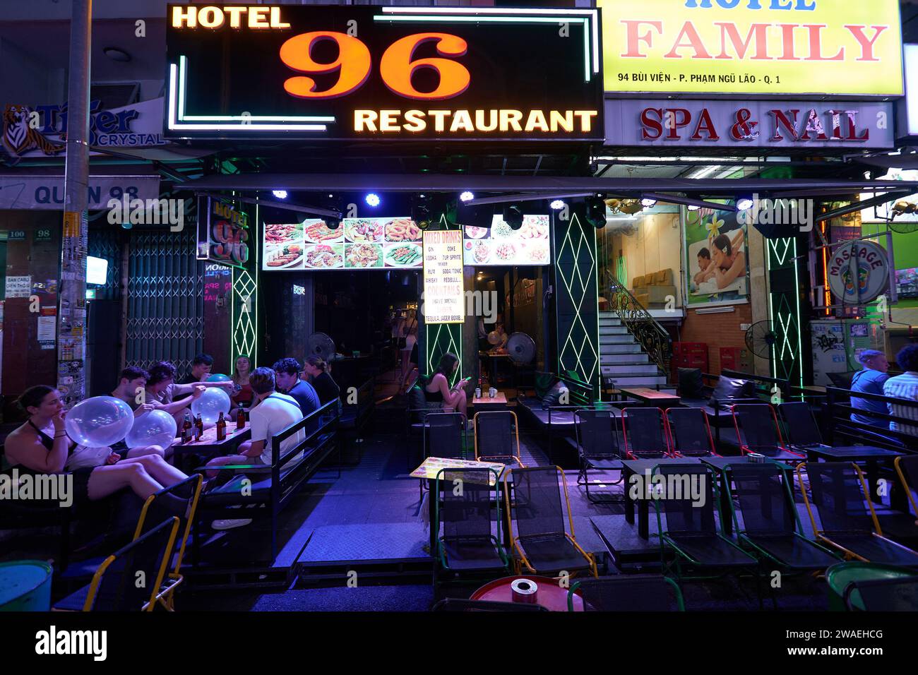 HO CHI MINH CITY, VIETNAM - MARCH 29, 2023: people sit at Hotel Restaurant 96 in Bui Vien ...