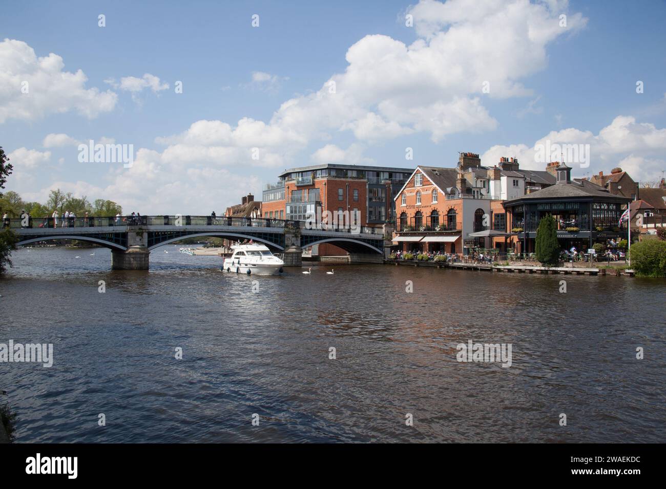 A small boat on the Windsor Eton Bridge, over the River Thames between ...